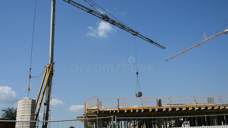 Scene of Crane at Building Construction Site with Workers on Buliding ...