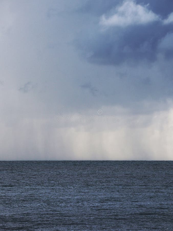 Dark Cloud with Heavy Rain Over the Sea Stock Image - Image of dark ...