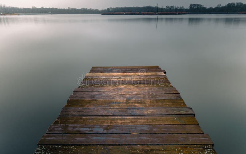 Scene of an Empty Dock Situated in Middle of a Tranquil Body of Water ...