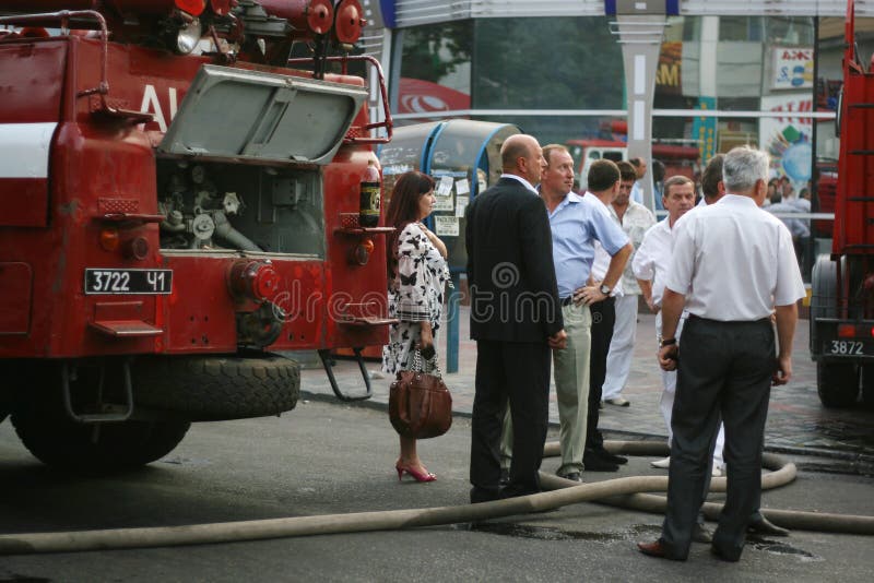 At the Scene of a Fire in a Building. Firefighters Work Concept ...