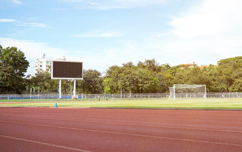 Scene of Football Field with Scoreboard and Bright Blue Sky Stock Image ...