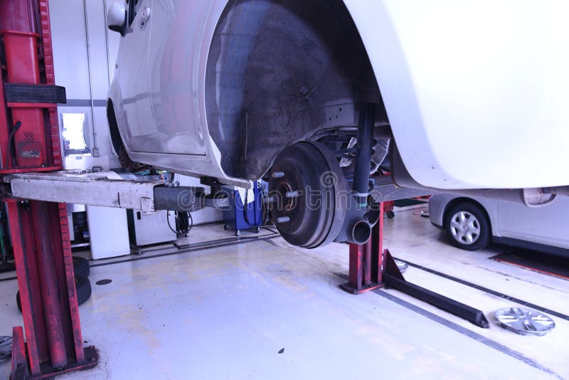 A Scene of Tire Replacement Work Stock Photo - Image of mechanic, safe ...