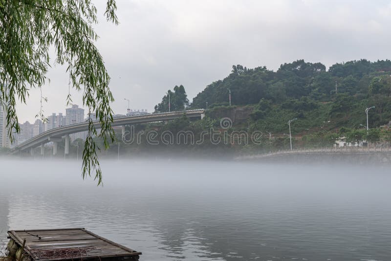 The Scenery on Both Sides of the River in the Morning Fog Stock Photo ...