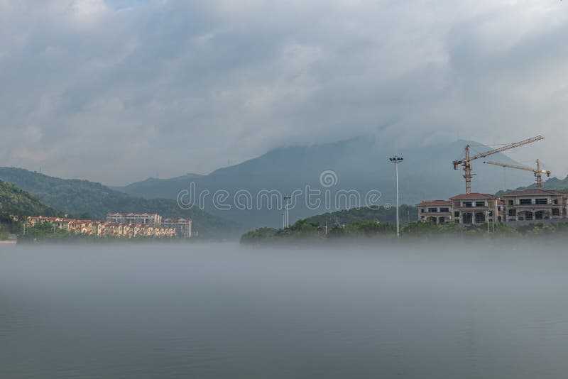 The Scenery on Both Sides of the River in the Morning Fog Stock Image ...