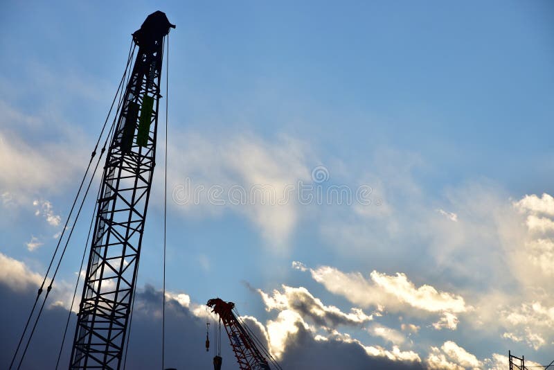 Crane building stock photo. Image of sunny, crane, city - 253880518