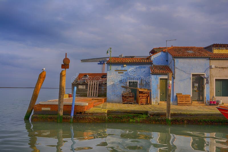 Scenery of a Dock with Buildings at the Ocean Shore Under the Cloudy ...