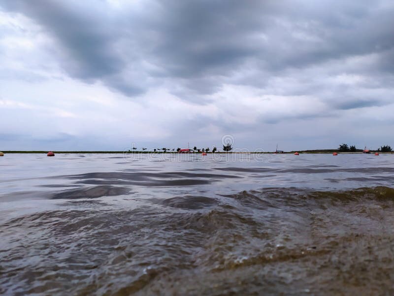 Scenery drawn by clouds stock image. Image of beach - 255309173