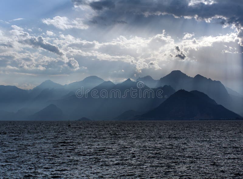 Scenery of Sea and Mountains on Background of Sky in Sun Rays Stock ...