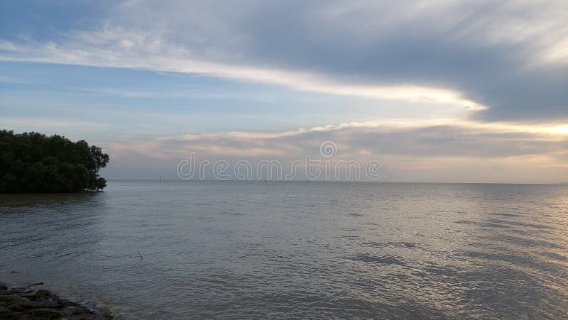 Scenery sunset beach stock photo. Image of cloud, reflection - 265176792