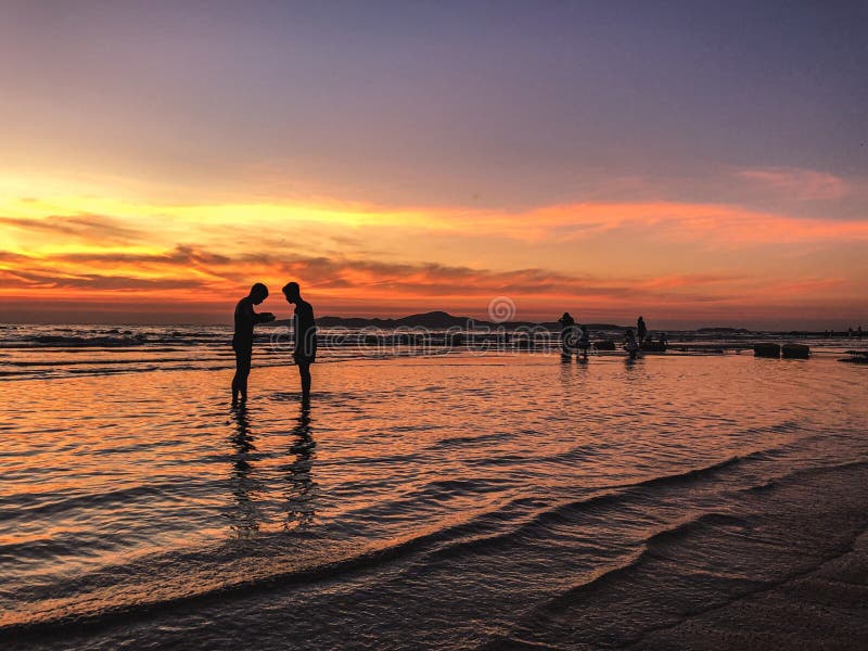 Scenery of Sunset with a Silhouette of People on the Beach Editorial ...