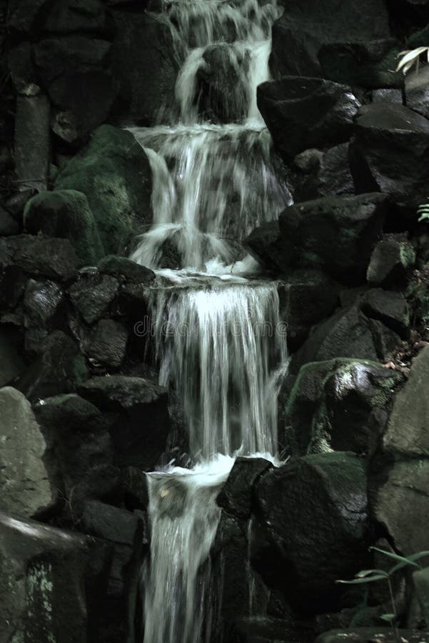 Scenery of Water Flowing from a Small Waterfall. Waterfall Background ...