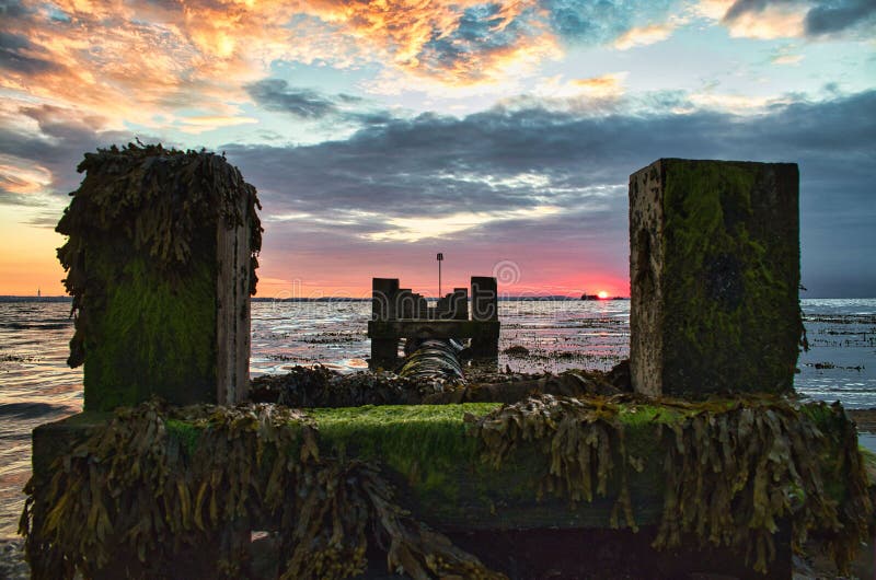 Scenic Beach with Big Rocks during a Dramatic Sunset in Isle of Wight ...