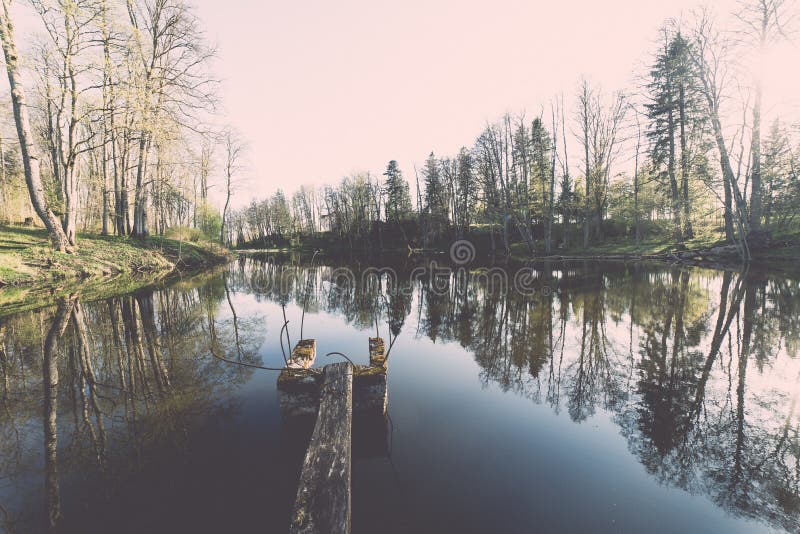 Scenic Reflections of Trees and Clouds in Water - Retro Vintage Stock ...