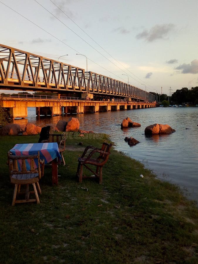 A Scenic Capture of a Bridge with a Table and Chairs Stock Image ...
