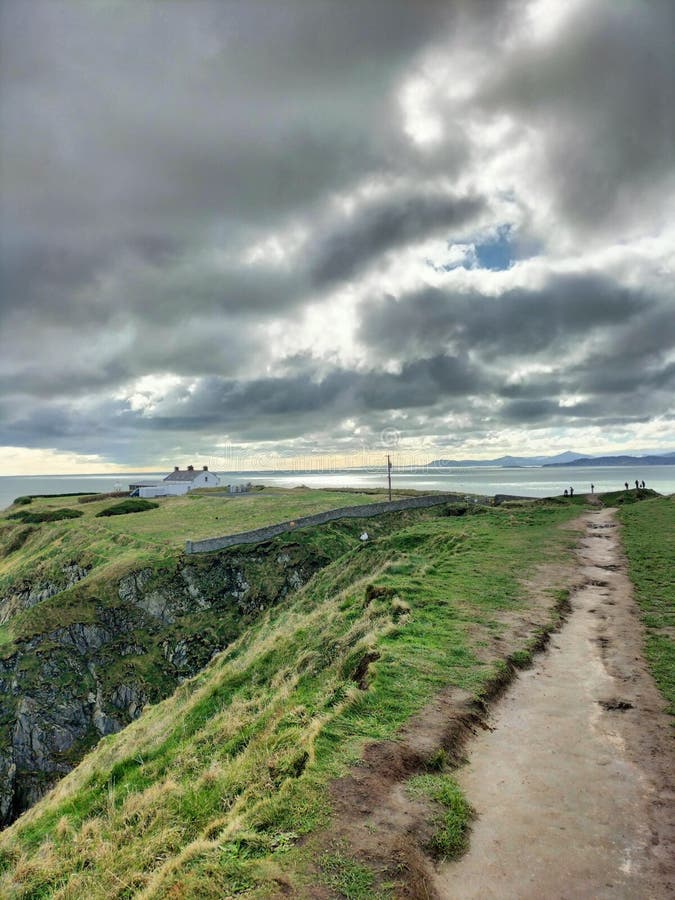 Scenic Coastal Cliff Path Under Dramatic Clouds Stock Photos - Free ...