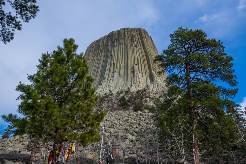Scenic Devils Tower between Trees Stock Photo - Image of clouds, stones ...