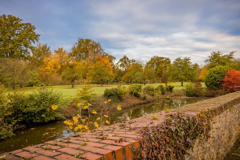 Scenic Fall Landscape with Red Brick Wall and Pond Near Mainz, German ...