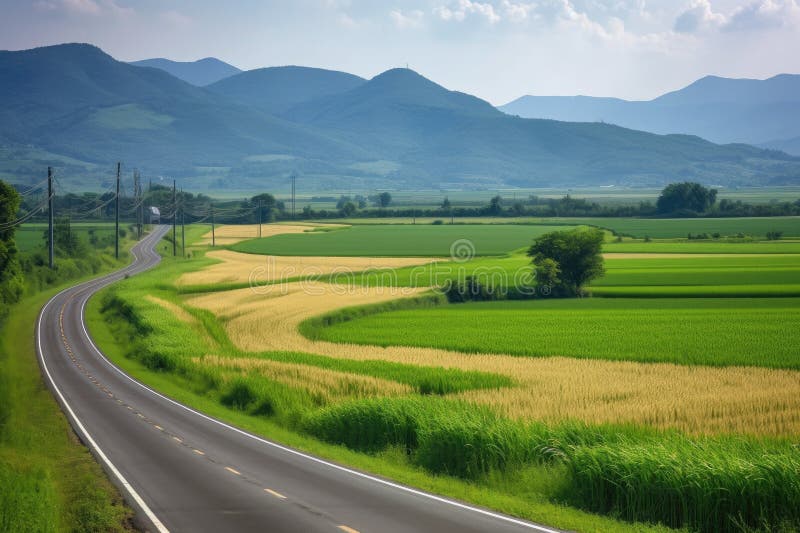 Scenic Highway, with Fields and Crops in the Foreground and Mountains ...