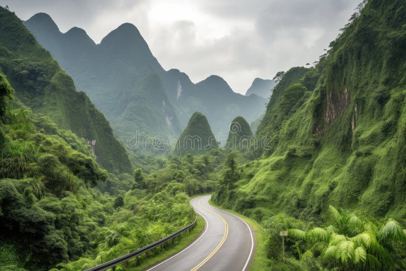 Scenic Highway with Towering Mountains in the Background, Surrounded by ...