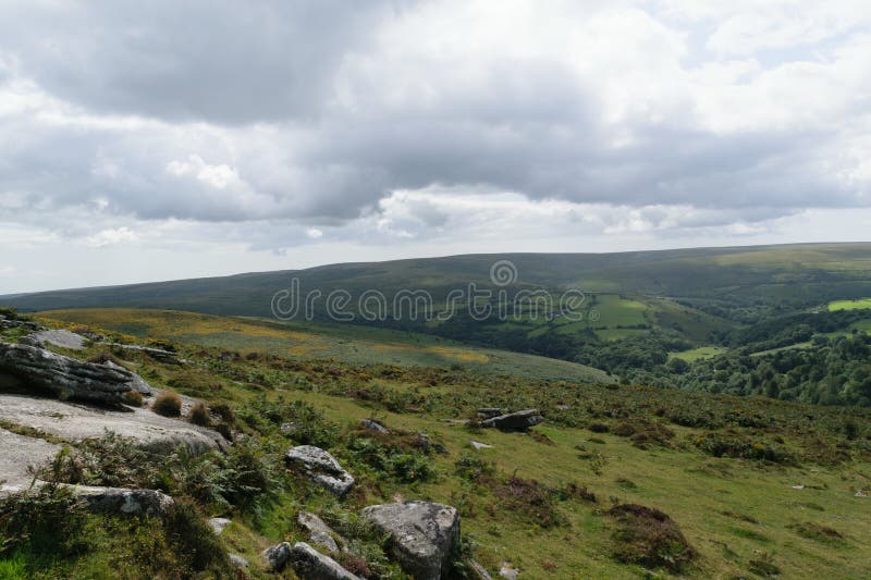 Scenic Hilly Landscape with Green Fields and Rocky Outcrops Stock Image ...