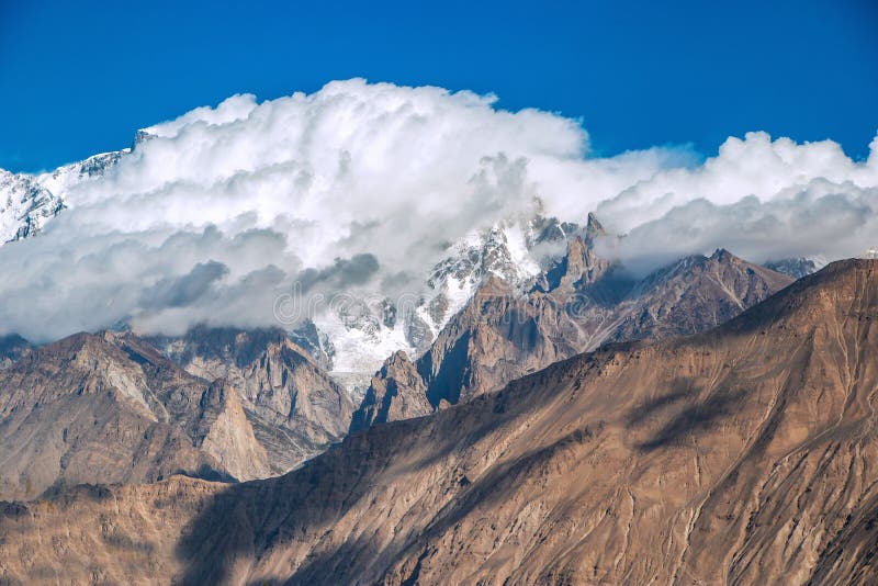 Scenic Hunza Peak Under the Cloudy Blue Sky in Pakistan Stock Image ...