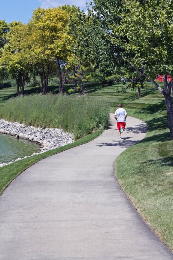 Scenic Jogging Path with Runner Stock Image - Image of lake, path: 12927183
