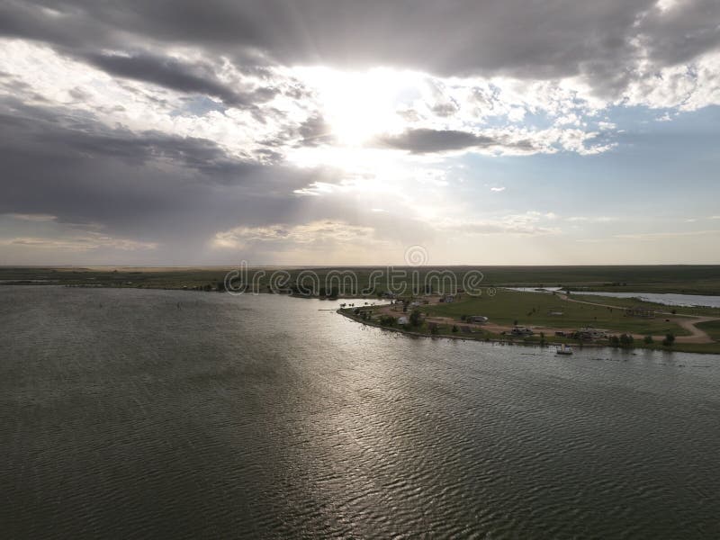 Scenic Lake View with Sun Rays through Clouds. Stock Photo - Image of ...