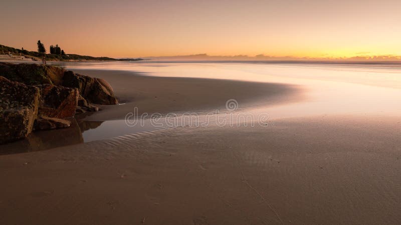 Scenic Landscape of a Calm Beach during Colorful Sunset Stock Photo ...