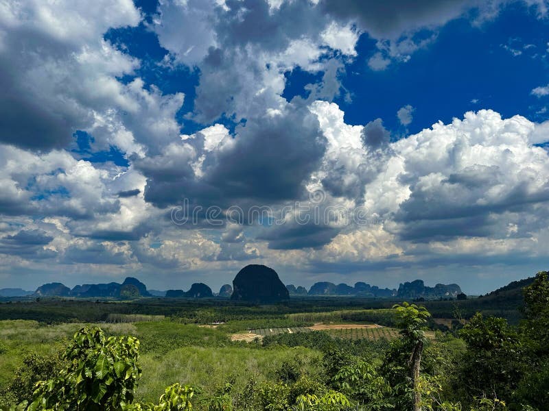 Scenic Landscape with Dramatic Clouds and Lush Greenery Stock Image ...