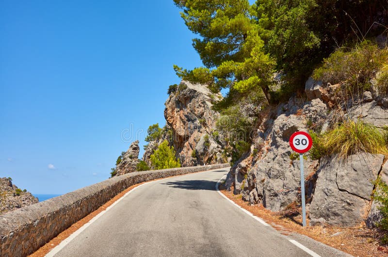 Scenic Mountain Road on a Cliff. Stock Image - Image of sign, asphalt ...