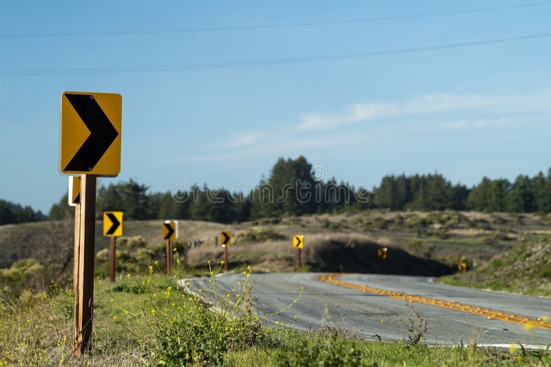 Scenic Mountain Road with Directional Arrows Pointing Right. Stock ...
