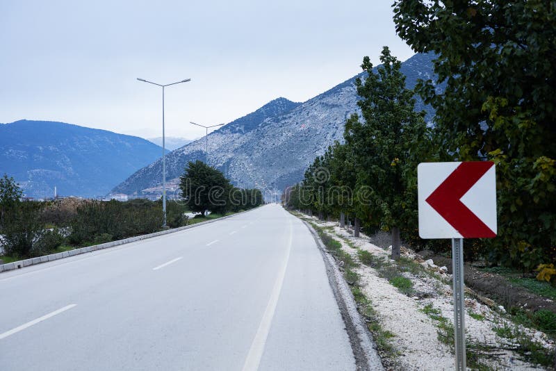 Scenic Mountain Road with Directional Sign Stock Image - Image of ...