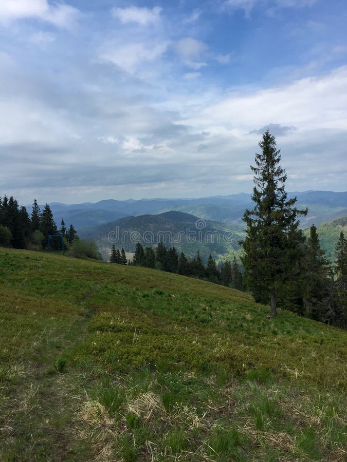 Scenic Mountain View with Lush Greenery and Clouds Stock Photo - Image ...