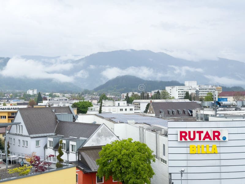 Scenic Overlook of Urban Landscape with Cloud-covered Mountains in the ...