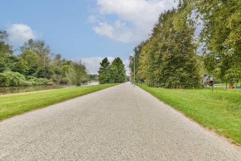 Scenic Pathway through Lush Greenery Stock Photo - Image of scenic ...