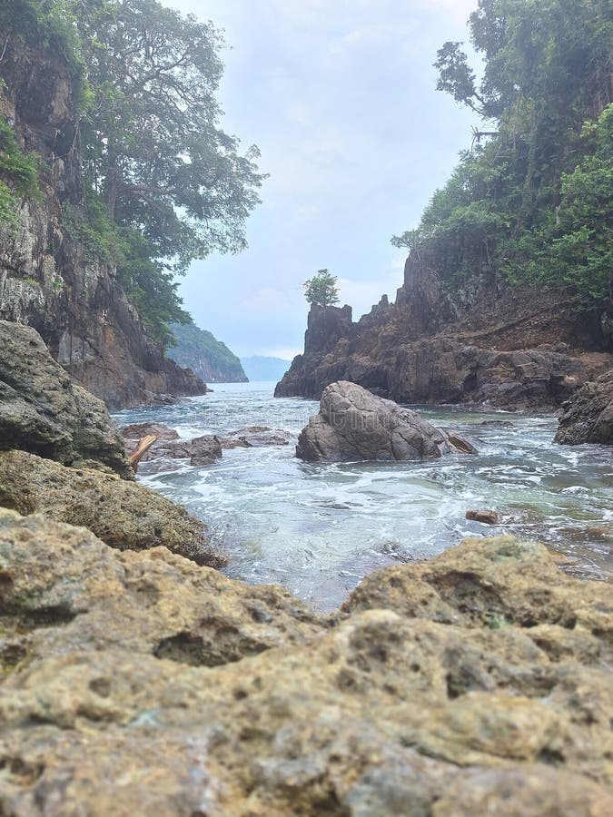 Scenic Rocky Inlet with Coastal Cliffs in East Java – Indonesia Stock ...