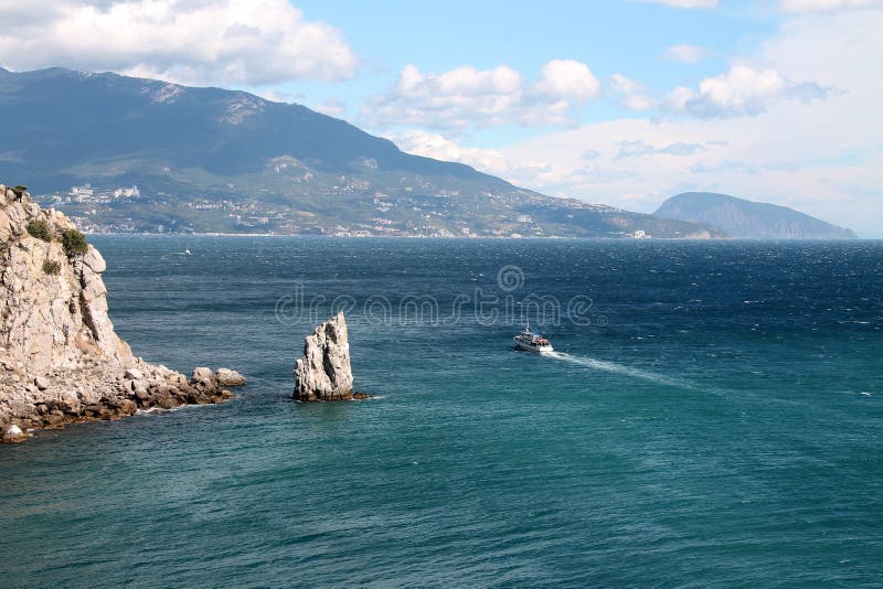 Scenic Sea View with Rocks and Cliffs. Ship Sails Away. Stock Photo ...