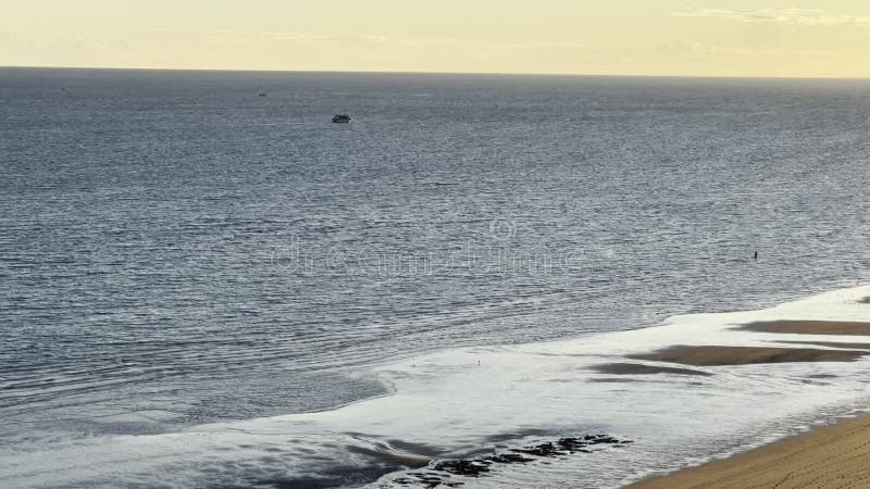 Scenic Shot of a Beach and a Low Tide with a Beautiful Sunset in the ...