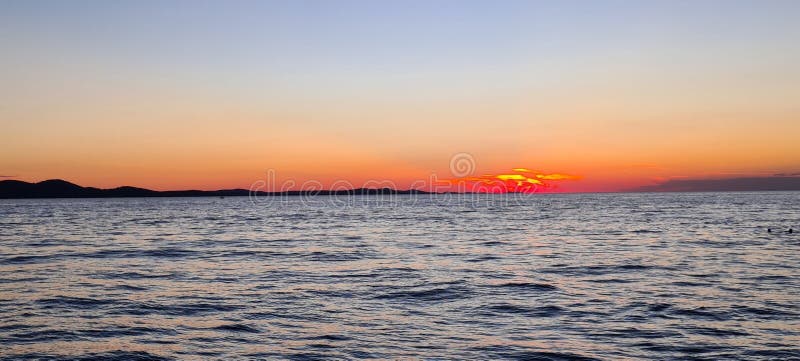 Scenic Shot of the Evening Red Sun Setting on the Horizon on the Ocean ...