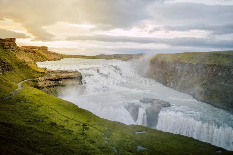 Scenic Shot of the Gullfoss Waterfall with Surrounding Fields Under the ...