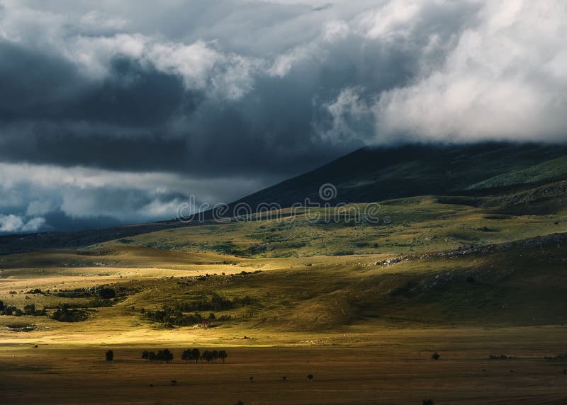 Scenic Shot of a Landscape with a Dense Clouds Covering the Mountains ...