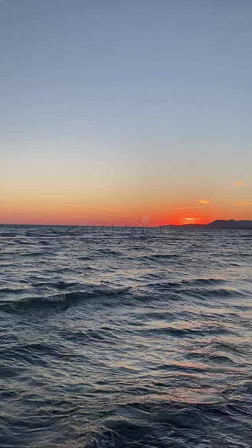 Scenic Shot of the Ocean Waves Moving Toward the Coast at Sunset Stock ...