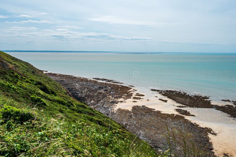 Scenic Shot of a Rocky Coastal Beach and a Cloudy Sky Stock Image ...