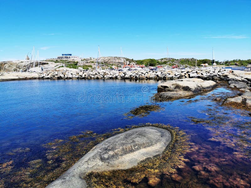 Scenic Shot of a Sea Surrounded by Stone Mountains in Verdens Ende ... Scenic Shot of a Sea Surrounded by Stone Mountains in Verdens Ende ...