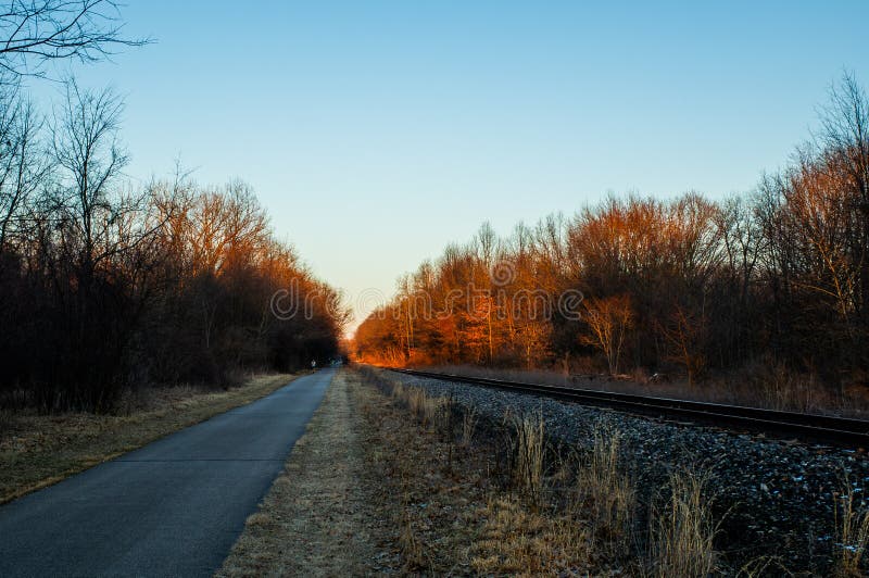 Scenic Sunset Behind Trees by Train Tracks Stock Image - Image of ...