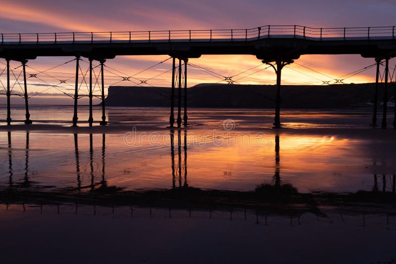 Sunset at Saltburn stock image. Image of reflections - 61316077