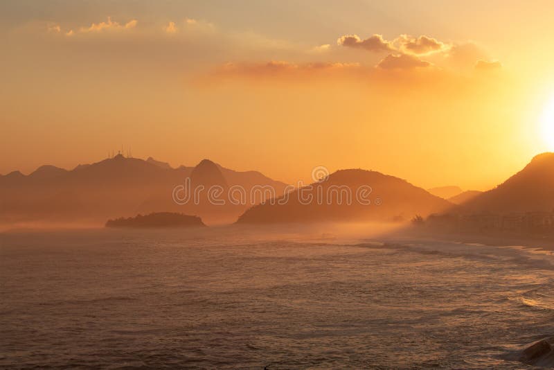 A View of a Sunset with Mountains in the Distance and Ocean Stock Image ...