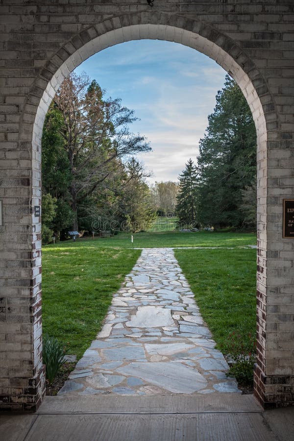 Scenic View through Archway Stock Photo - Image of brick, flagstone ...