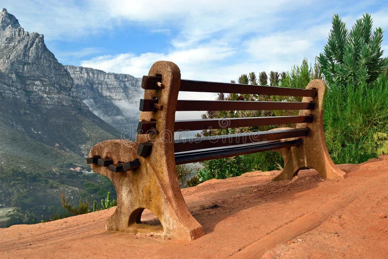 Scenic View of a Bench Overlooking a Mountain Range with Rolling Hills ...