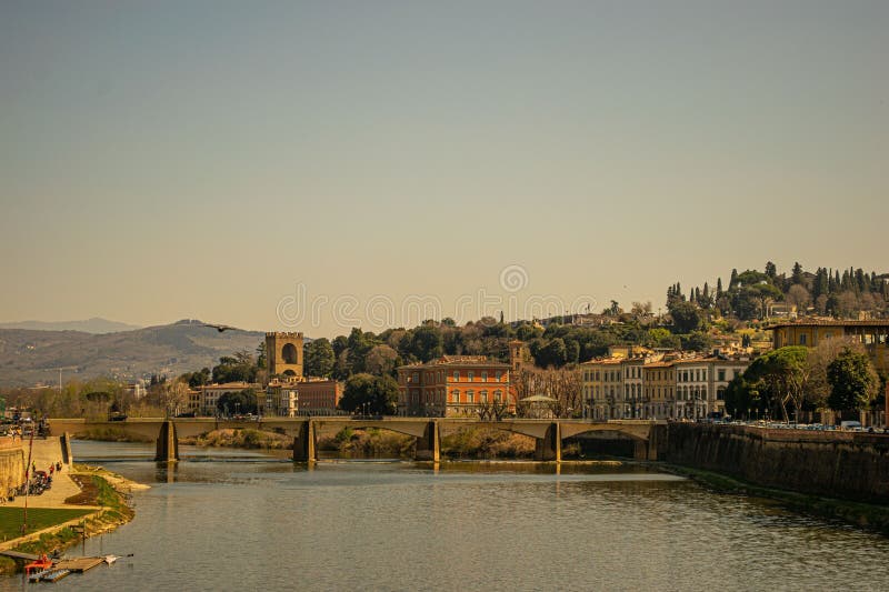 Scenic View of a Bridge Over a River with a Clock Tower in the ...